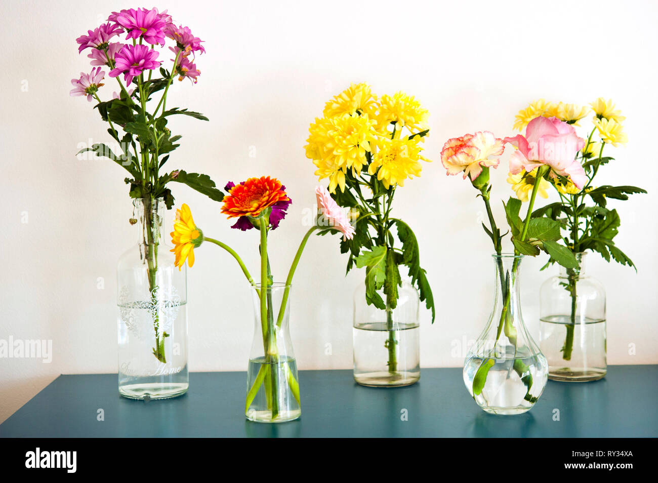various colorful flowers in differently shaped vases Stock Photo - Alamy