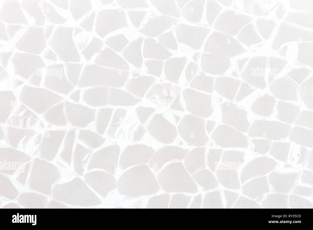 Broken windshield glass texture on a gray background. Broken glass with ...