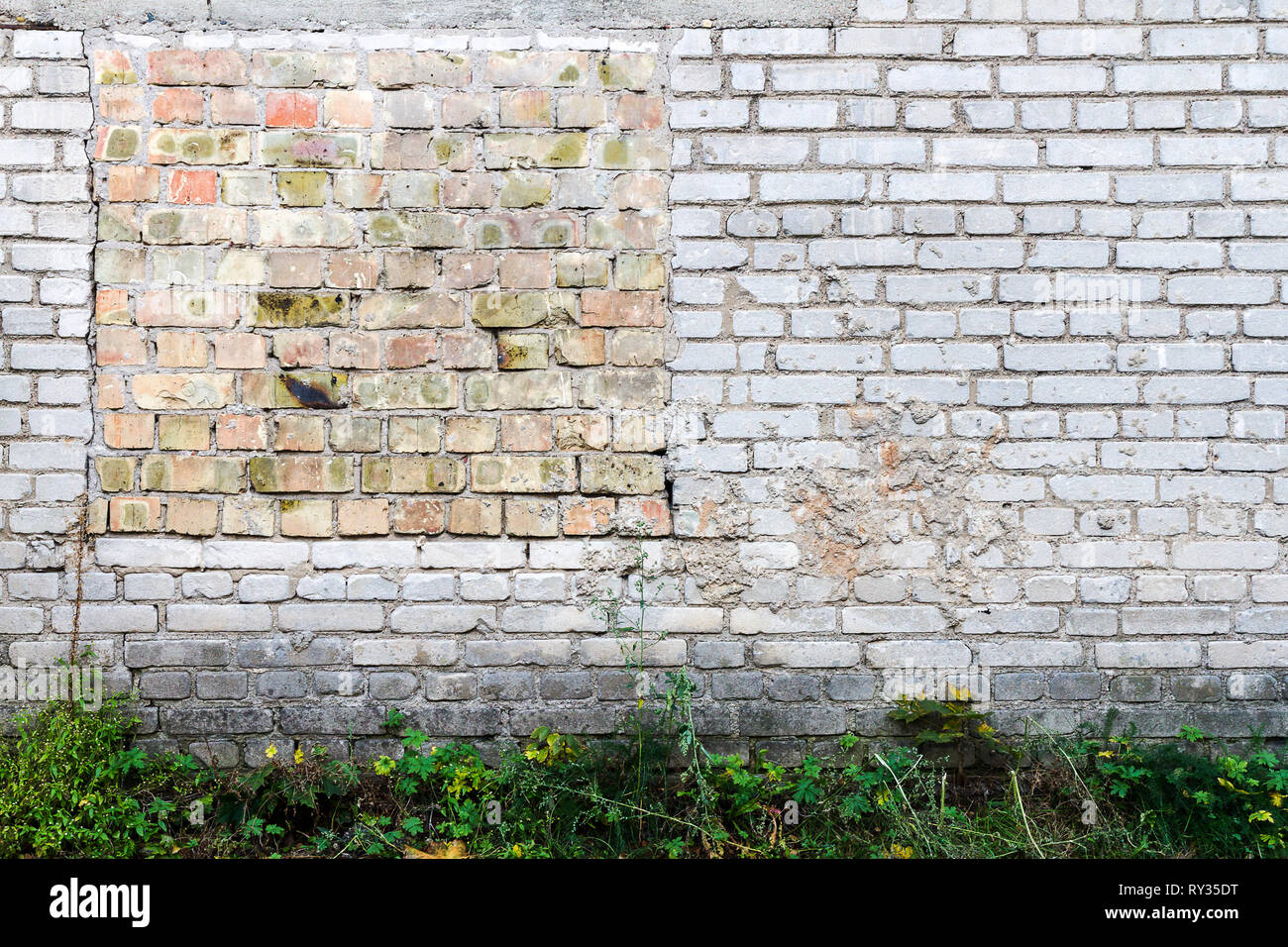 Old gungy white brick wall with bricked up window Stock Photo - Alamy