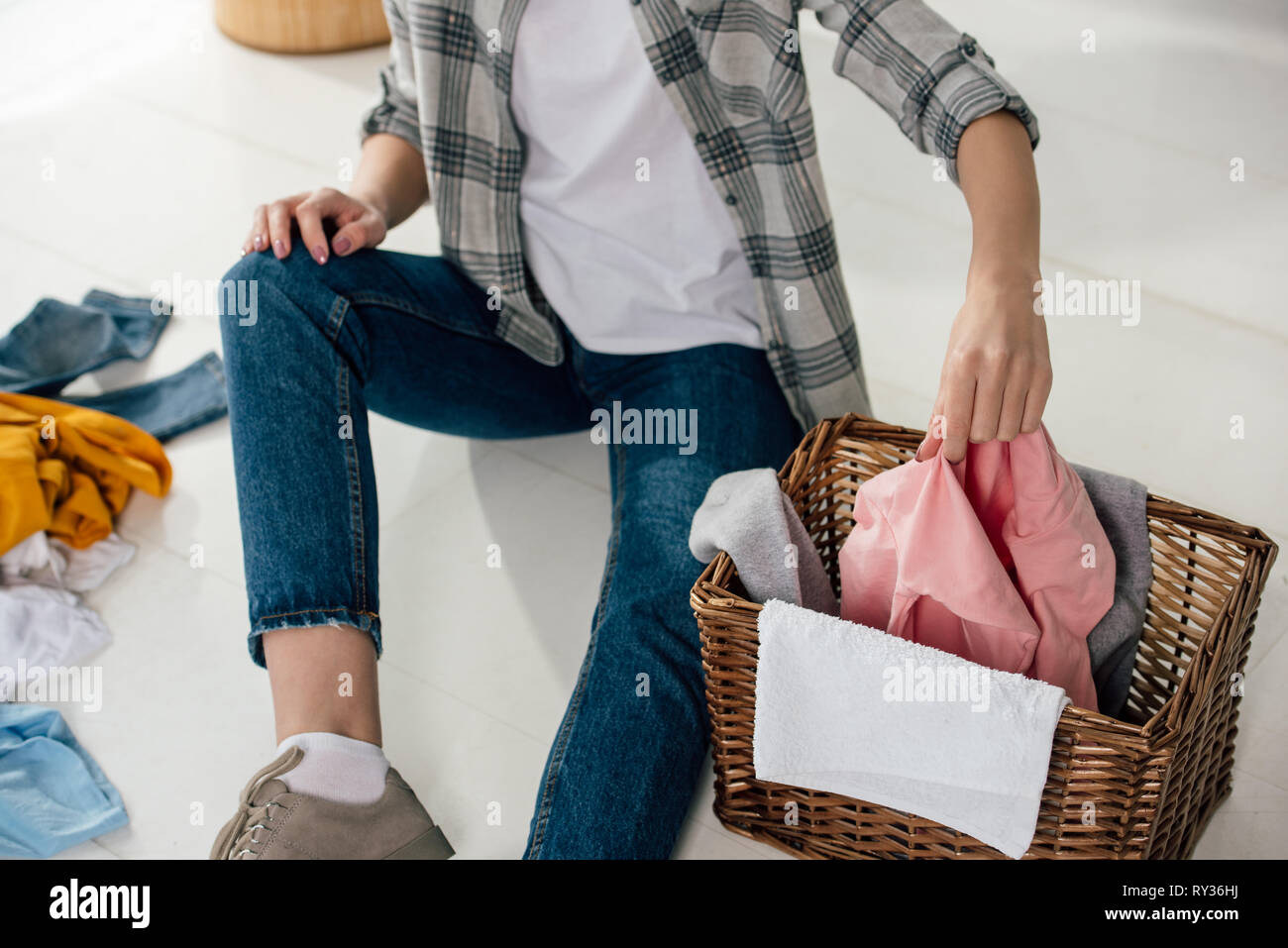 Woman putting on clothes home hi-res stock photography and images - Alamy