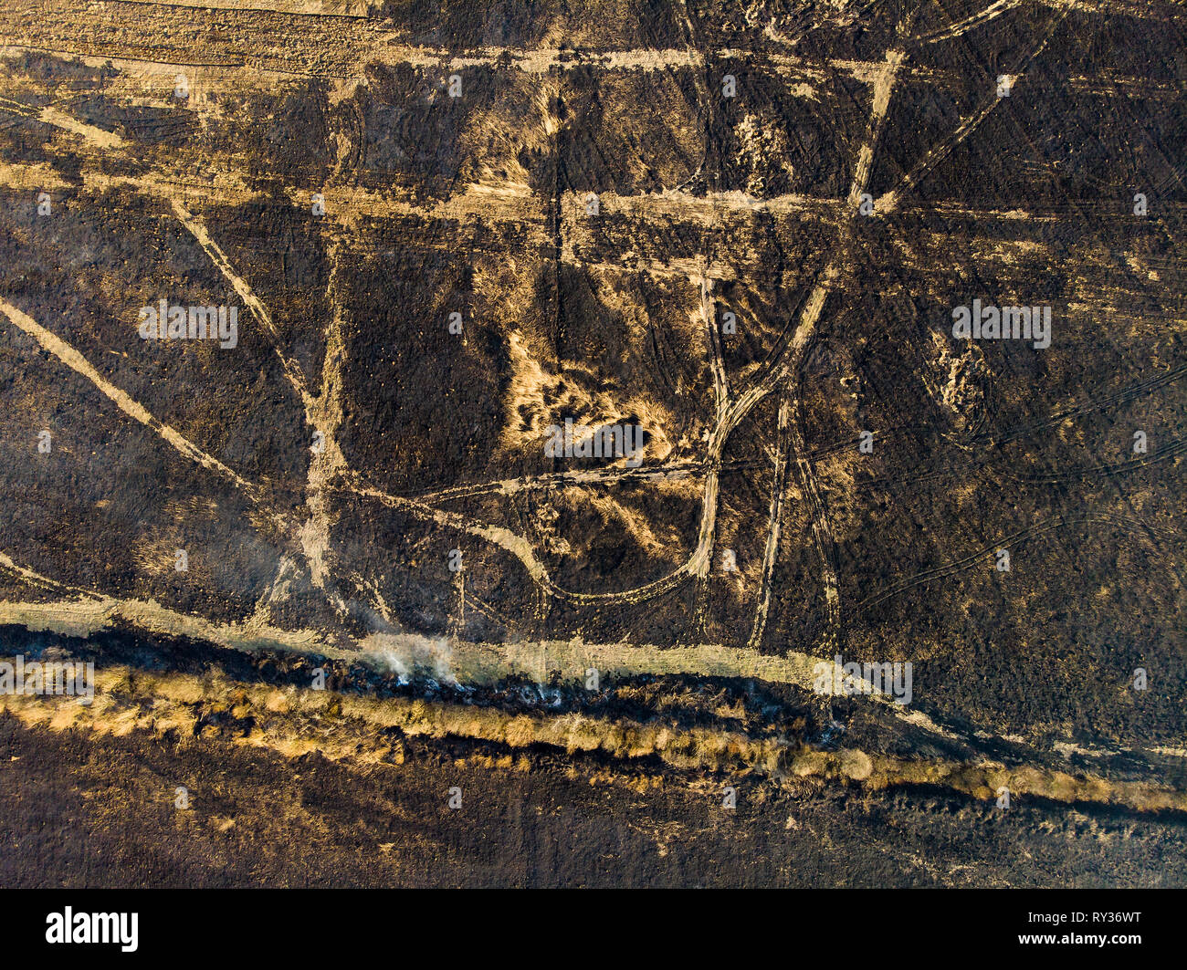 Devastated land, after a fire, top view. Disaster and emergency events ...