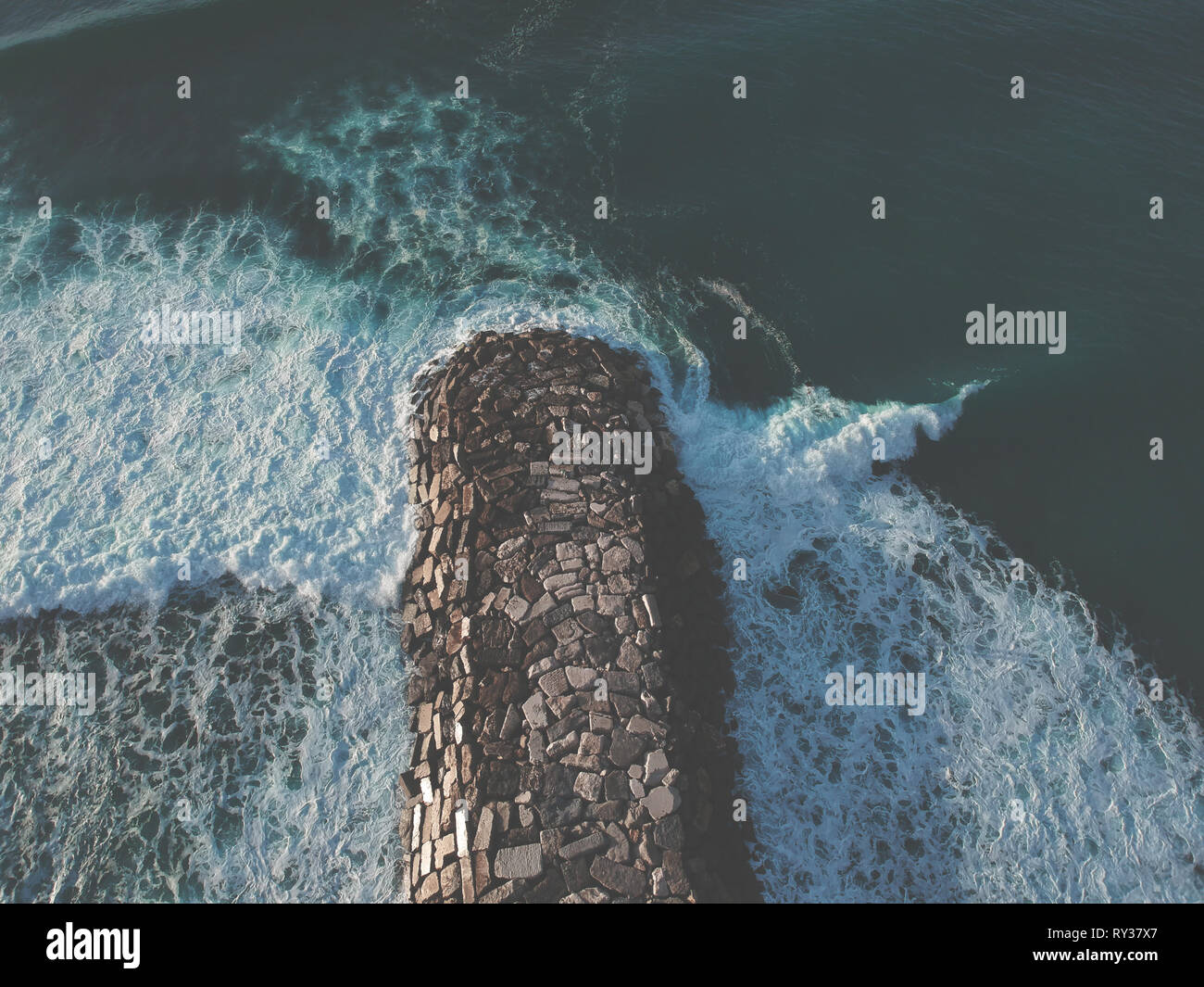 Aerial top view from a stone Jetty. Drone photo Stock Photo - Alamy