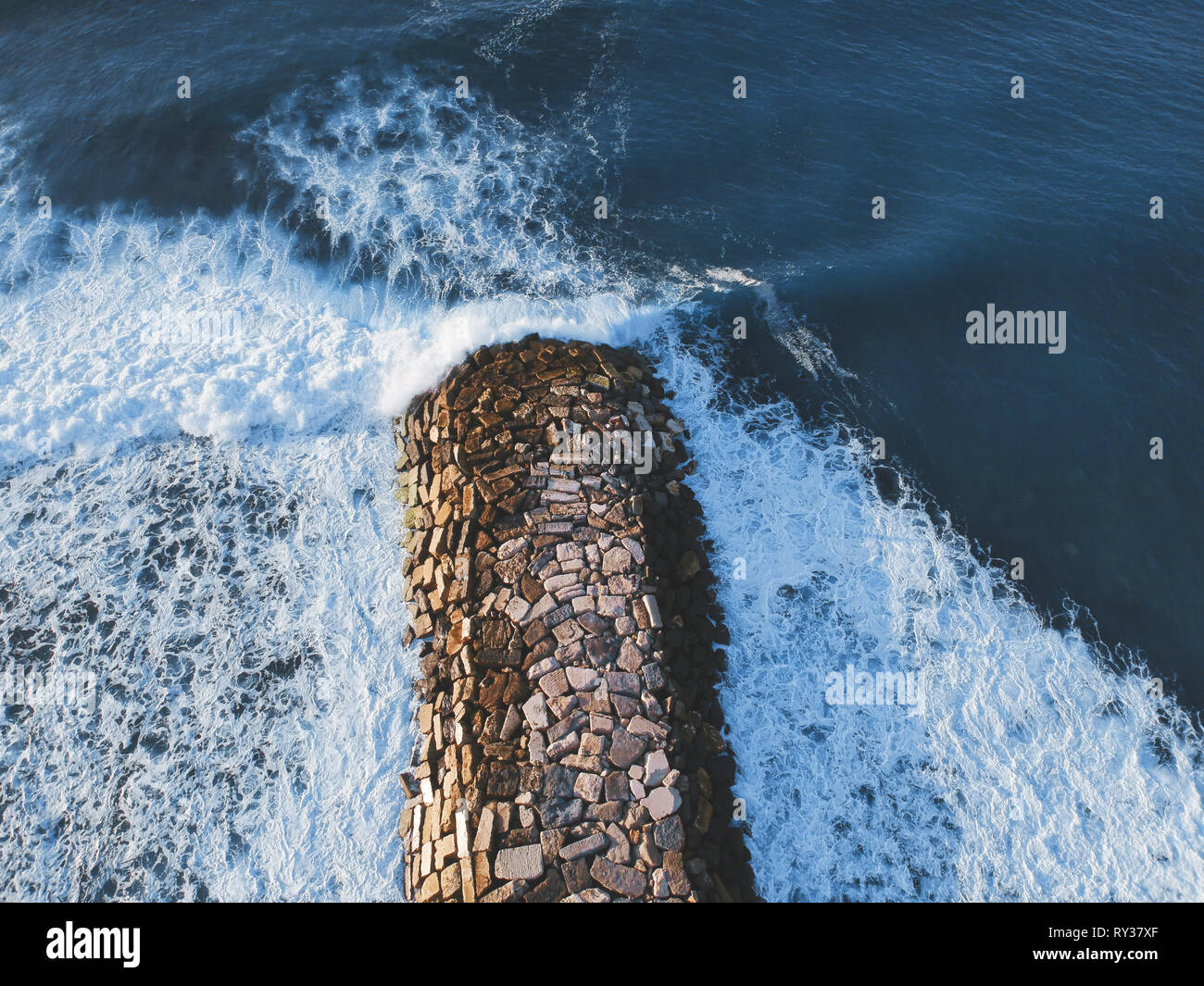 Aerial top view from a stone Jetty. Drone photo Stock Photo - Alamy