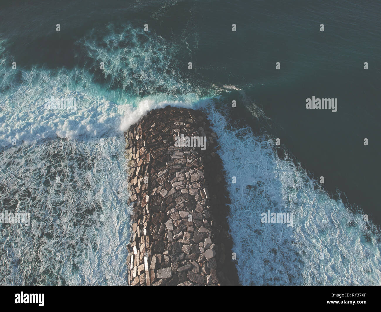 Aerial top view from a stone Jetty. Drone photo Stock Photo - Alamy