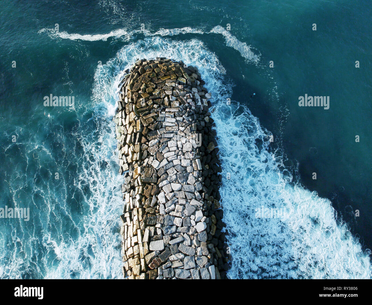 Aerial top view from a stone Jetty. Drone photo Stock Photo - Alamy