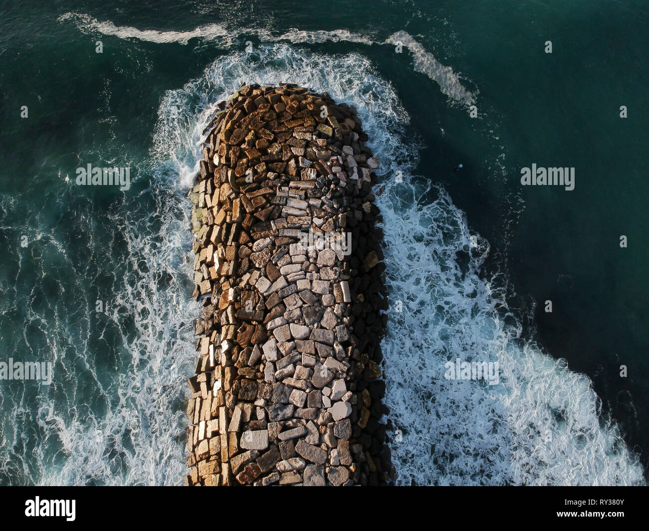 Aerial top view from a stone Jetty. Drone photo Stock Photo - Alamy