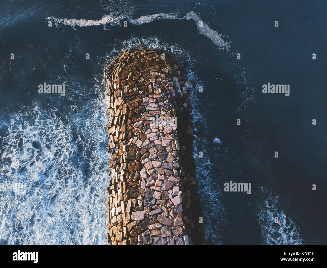 Aerial top view from a stone Jetty. Drone photo Stock Photo - Alamy
