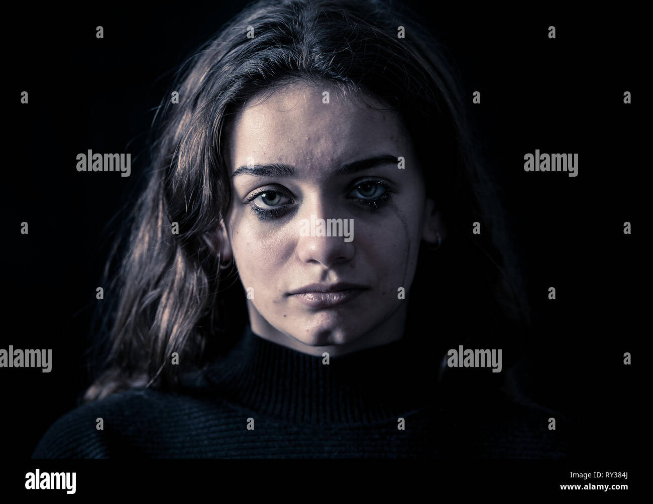 Closeup of a bullied, depressed, alone, tired, stressed young child ...