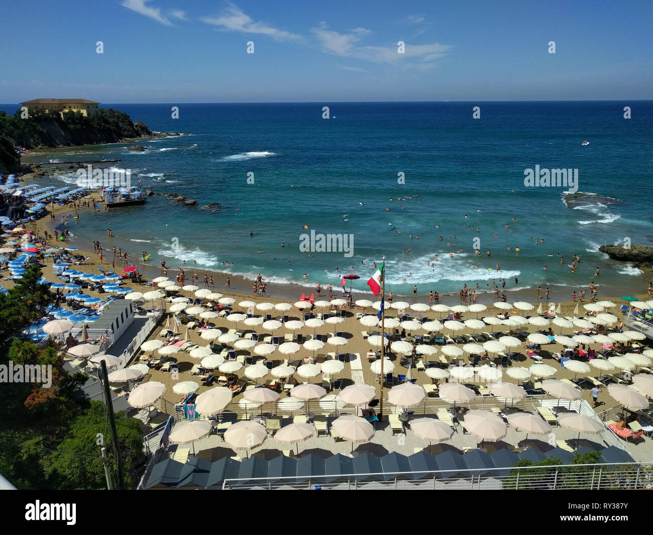 The view of a beach and sea at Castiglioncello bay in a sunny day ...