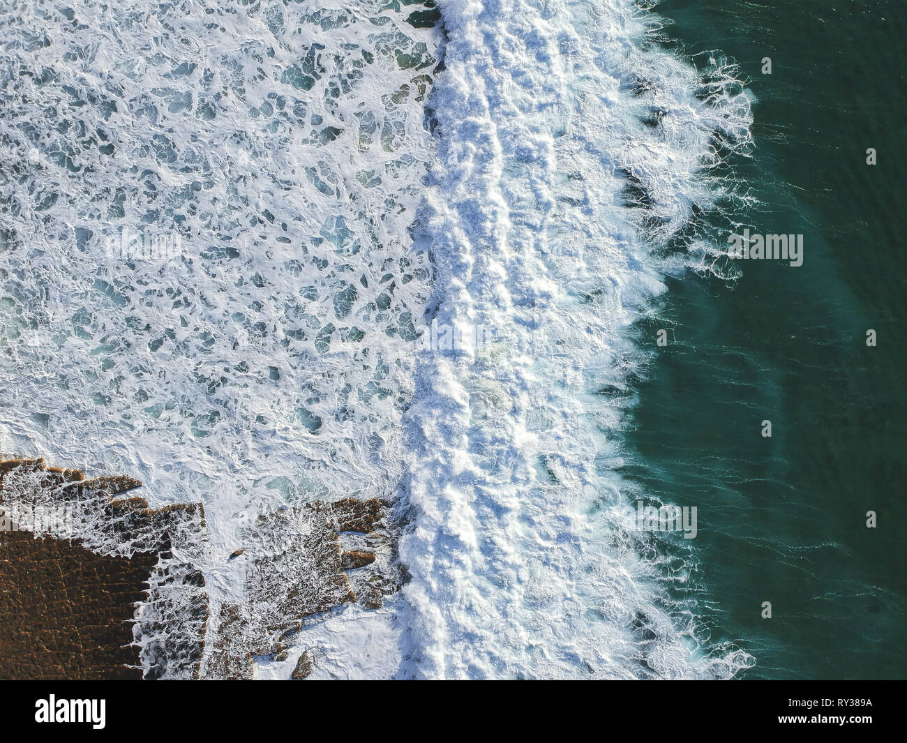 Aerial top view of ocean wave with foam. Drone Photo Stock Photo - Alamy
