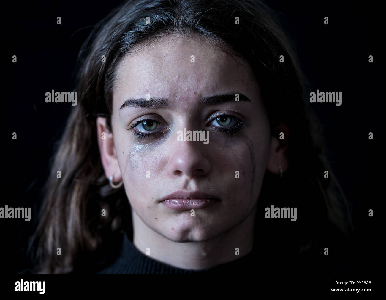 Scared upset girl bullied online suffering harassment crying feeling ...