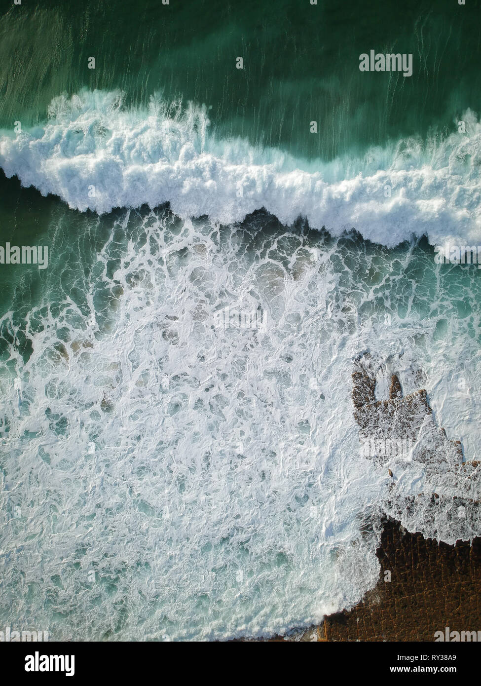 Aerial top view of ocean wave with foam. Drone Photo Stock Photo - Alamy