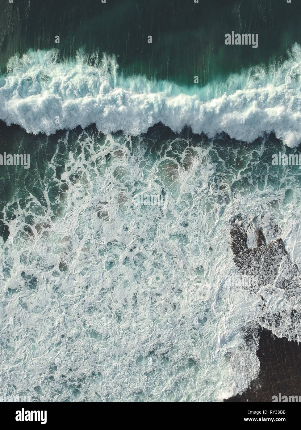 Aerial top view of ocean wave with foam. Drone Photo Stock Photo - Alamy