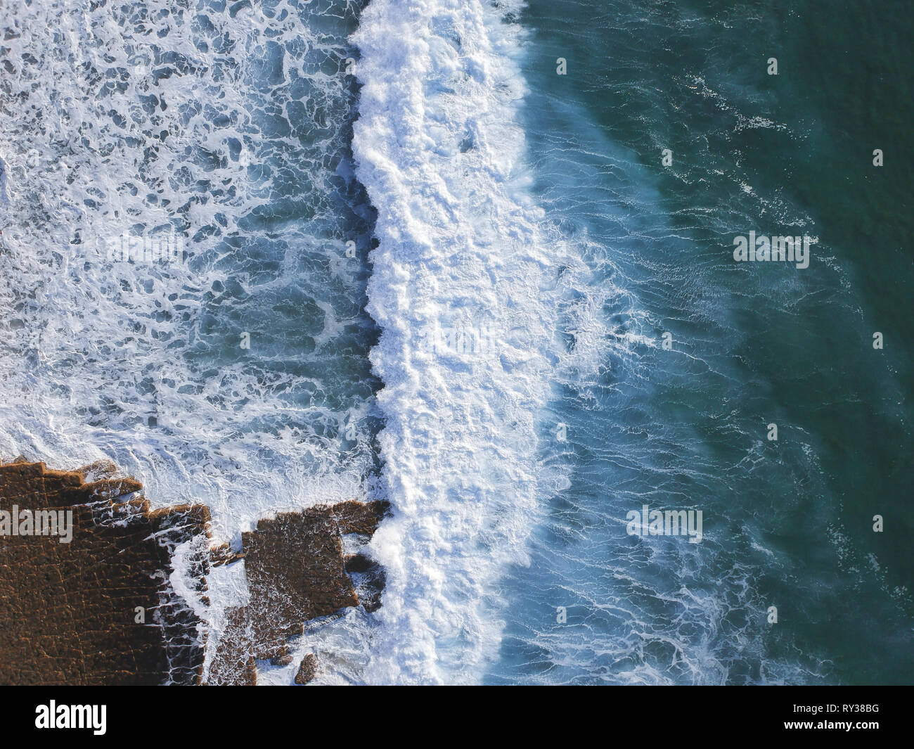 Aerial top view of ocean wave with foam. Drone Photo Stock Photo - Alamy