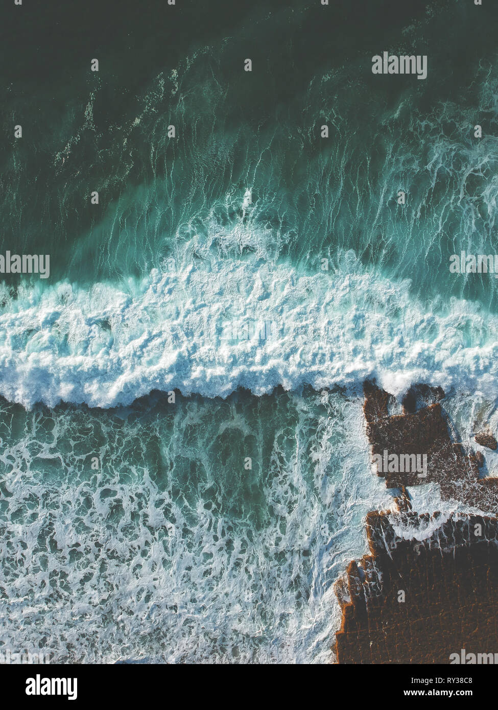 Aerial top view of ocean wave with foam. Drone Photo Stock Photo - Alamy
