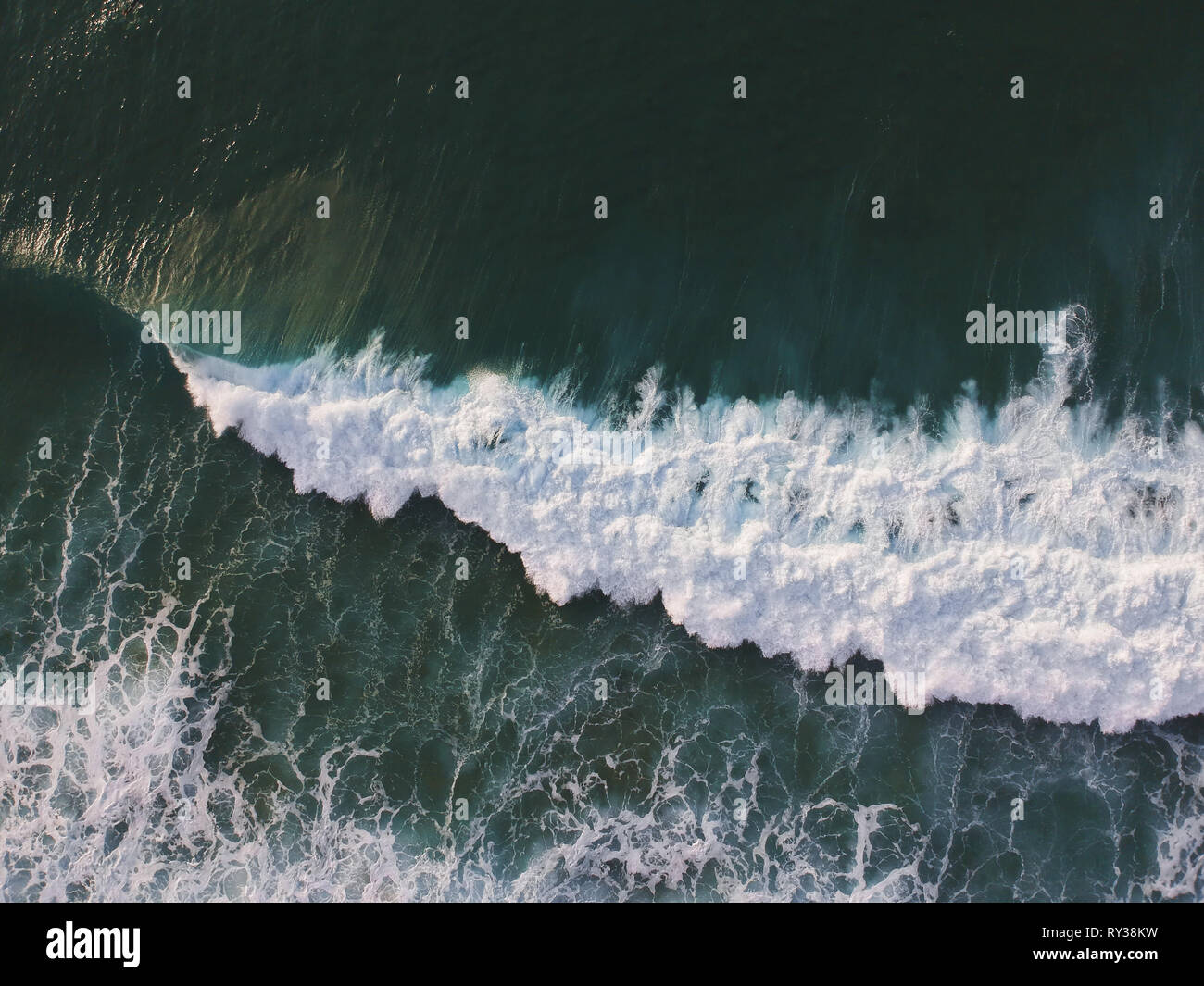 Aerial top view of ocean wave with foam. Drone Photo Stock Photo - Alamy