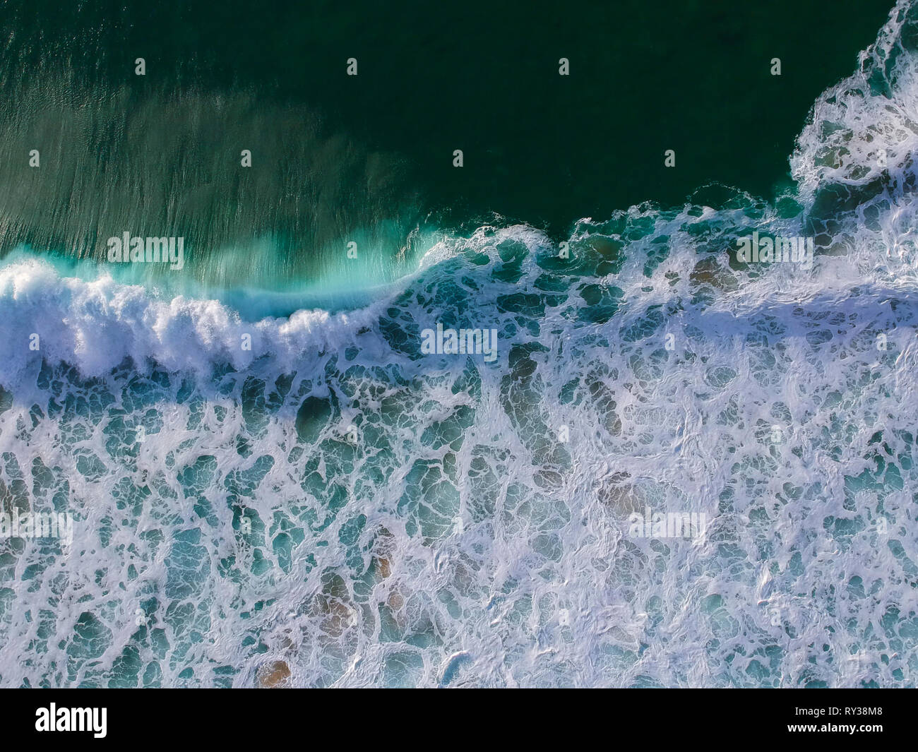 Aerial top view of ocean wave with foam. Drone Photo Stock Photo - Alamy