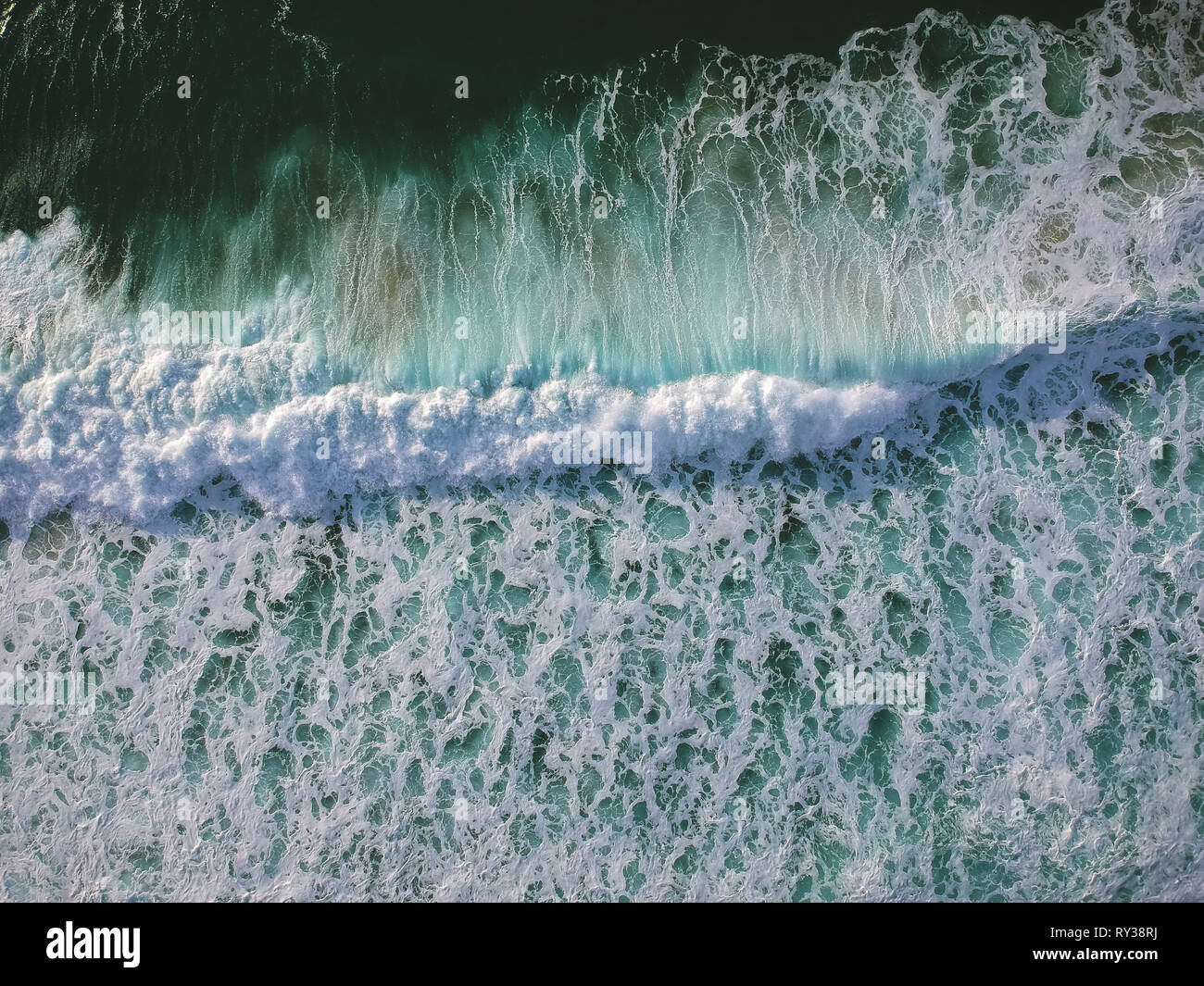 Aerial top view of ocean wave with foam. Drone Photo Stock Photo - Alamy
