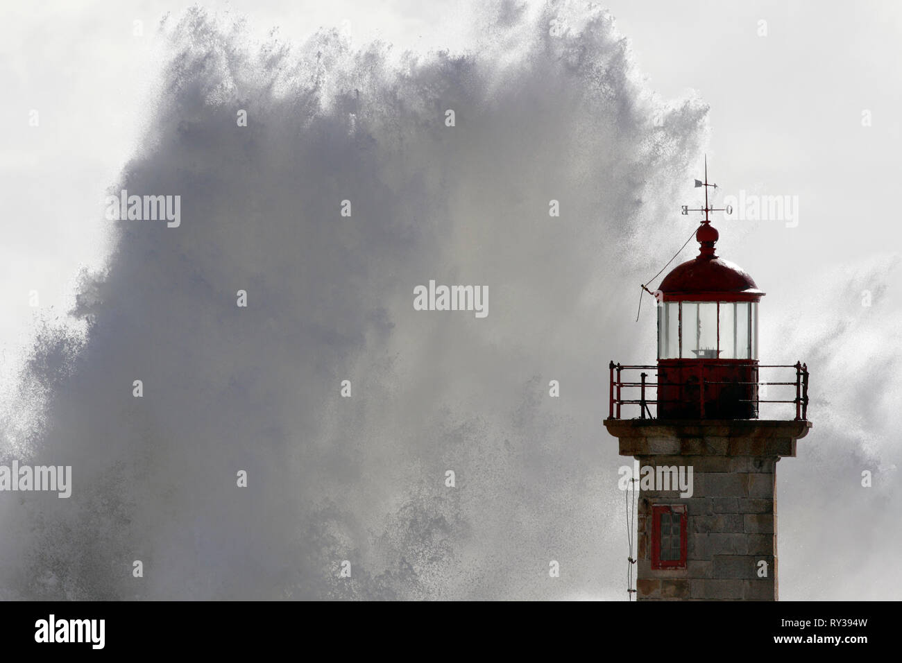 Big wave splash. Douro river mouth old lighthouse, Porto, Portugal ...