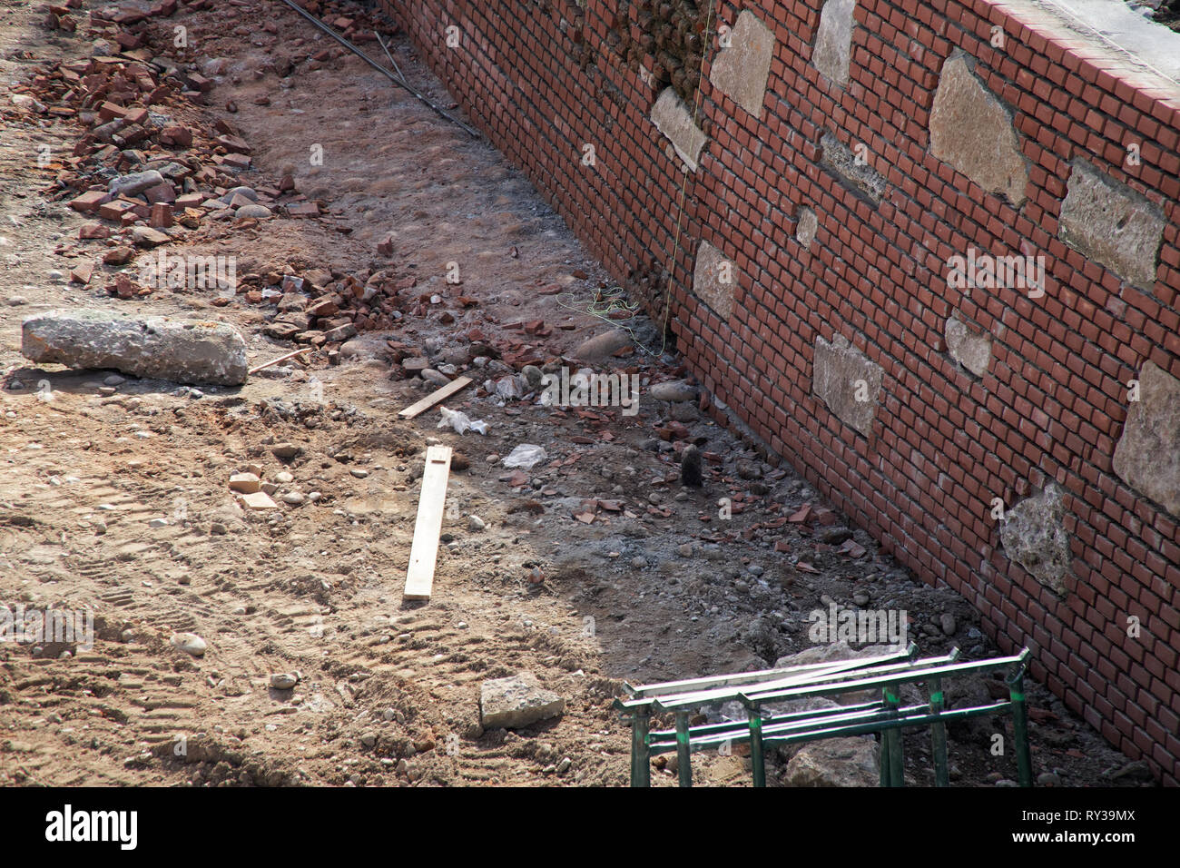 Construction Site damaged wall repairing, construction machinery ...
