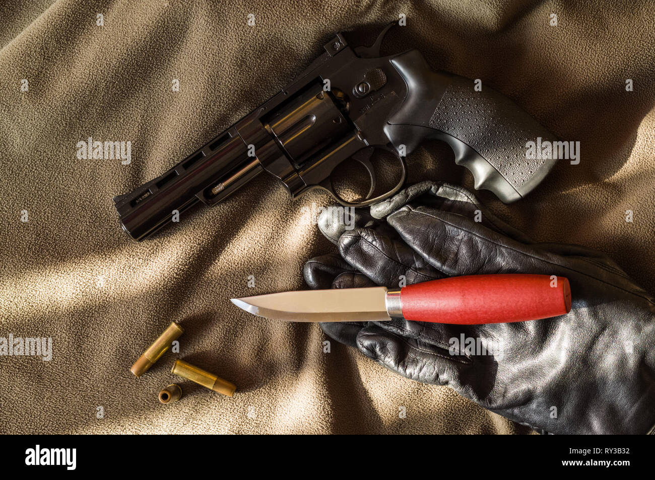 Firearms and edged weapons. Knife and gun. Top view Stock Photo - Alamy