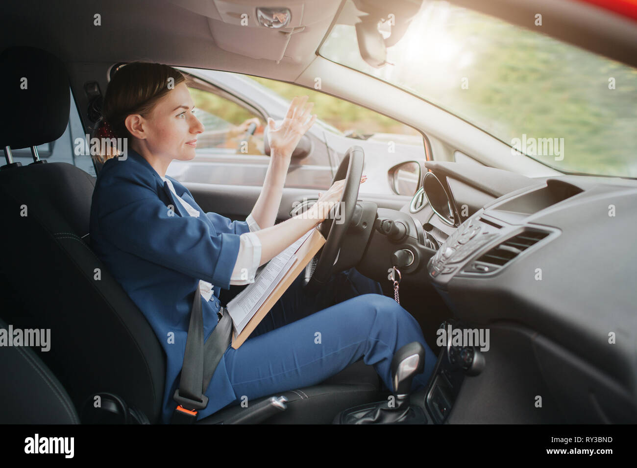 A woman feels stress on the road. Big Traffic jams. Business woman is ...