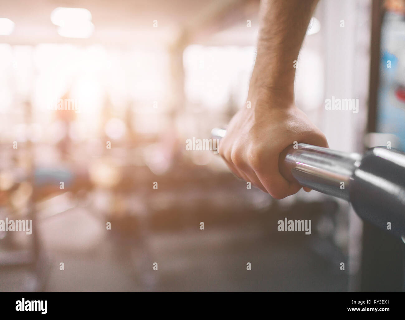 The hand is close-up. Workout in the gym. Dips on parallel bars ...