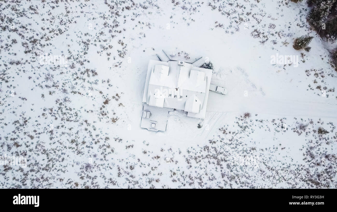 Aerial view of the mountain house covered in snow in the Winter Stock ...