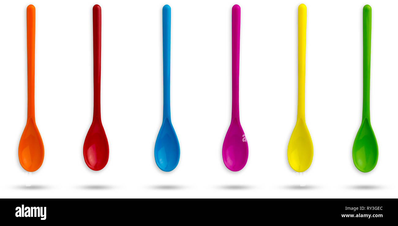 Set of multicolour plastic spoons on isolate white background with ...
