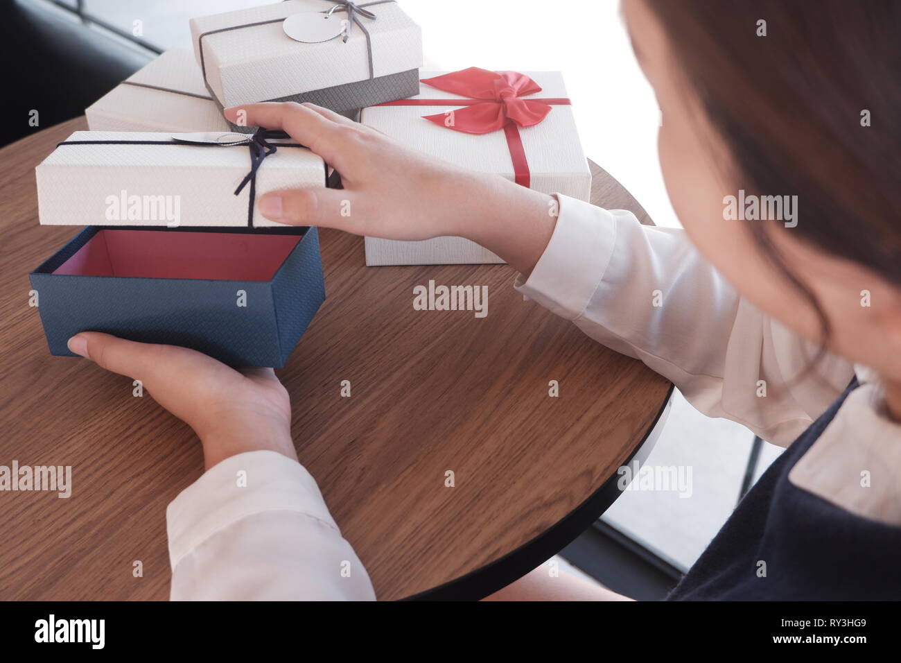 Opening a gift hi-res stock photography and images - Alamy