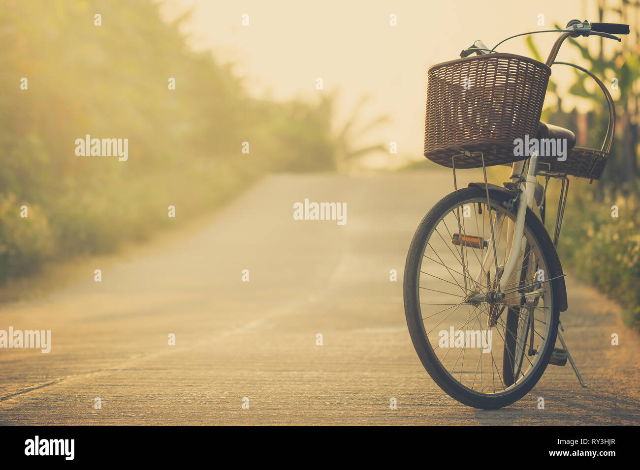 Bicycle on the side of the road way with mountains background. Copy ...