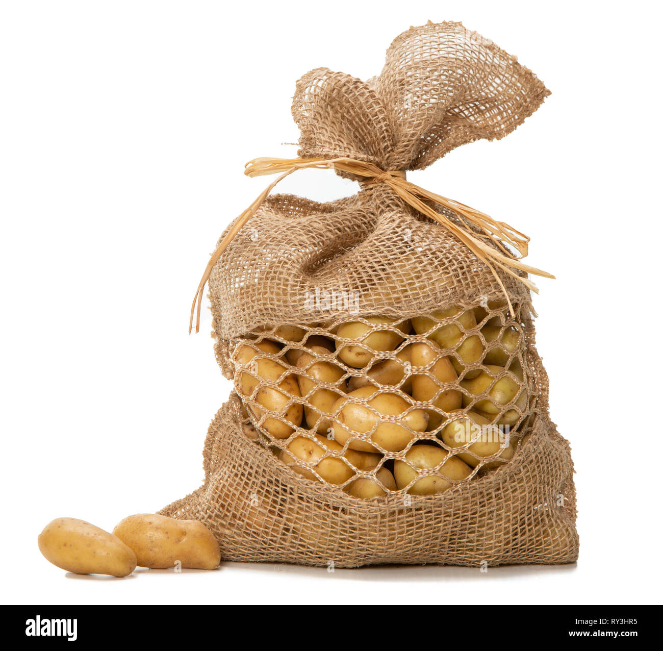 Small potato in a pretty jute bag on a white background Stock Photo - Alamy
