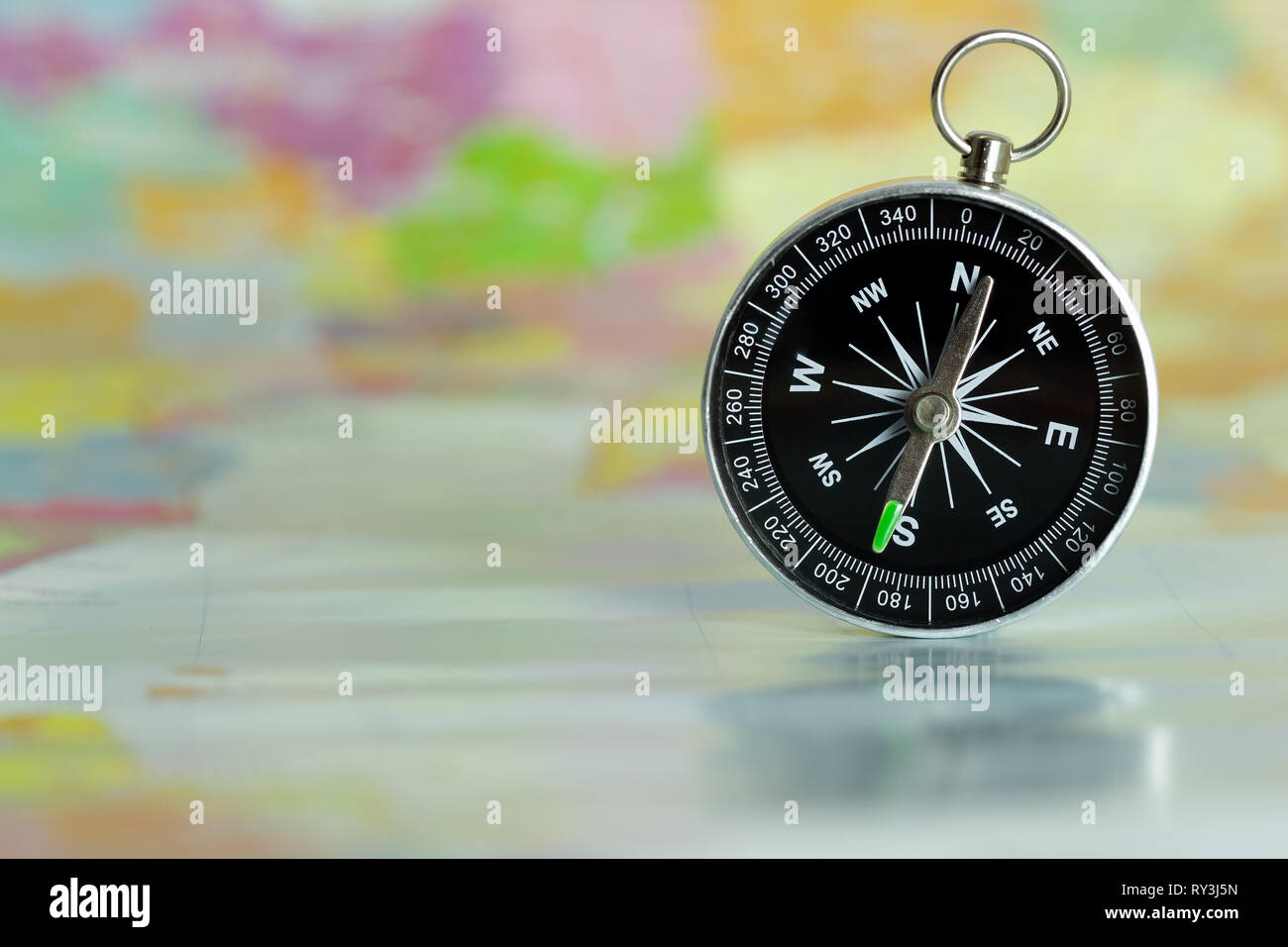 Compass laid on a paper map. The concept of travel Stock Photo - Alamy