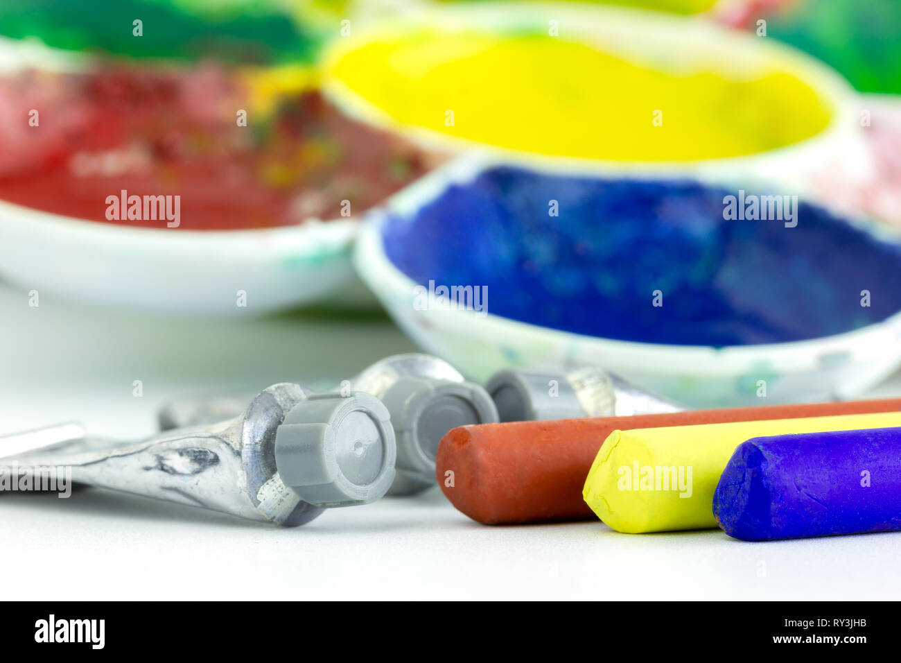 Color tubes and palettes placed on white background. Suitable for ...