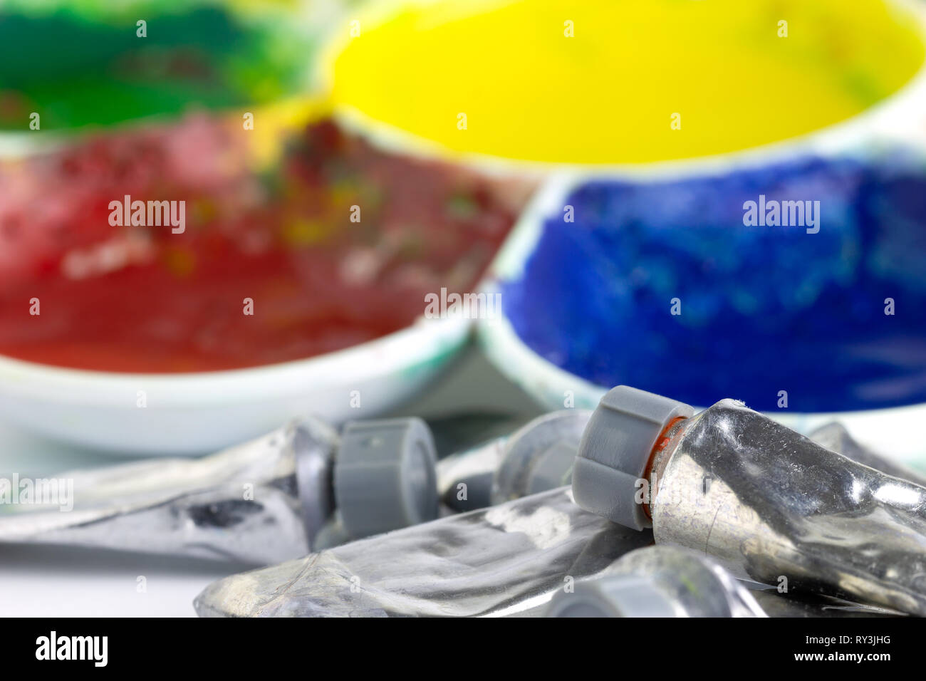 Color tubes and palettes placed on white background. Suitable for ...