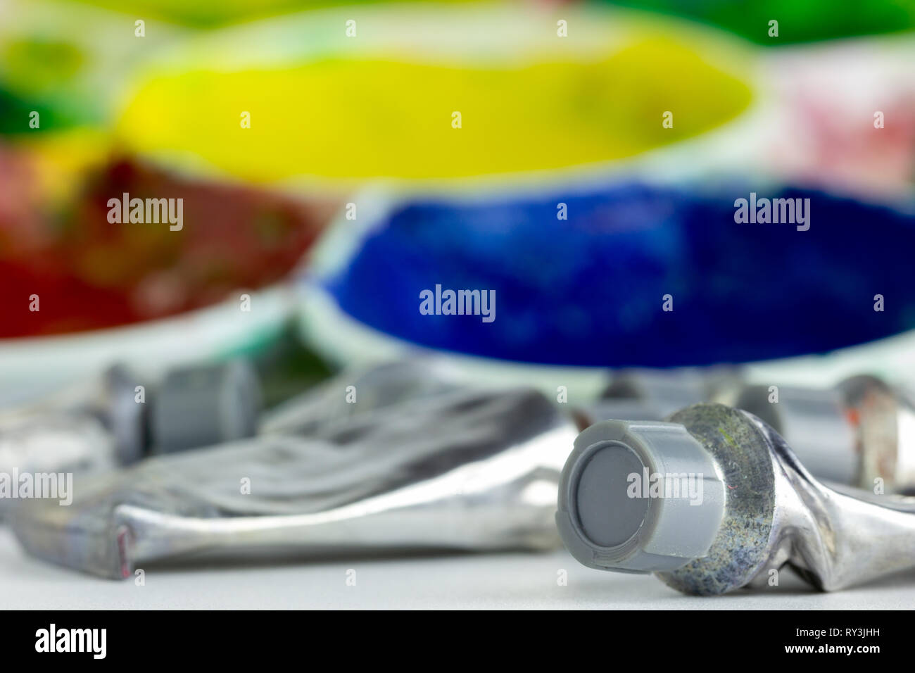 Color tubes and palettes placed on white background. Suitable for ...