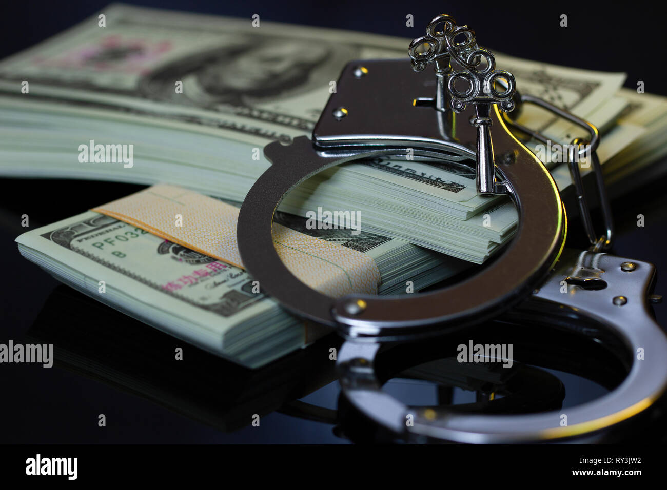 Dollar bills in handcuffs hi-res stock photography and images - Alamy