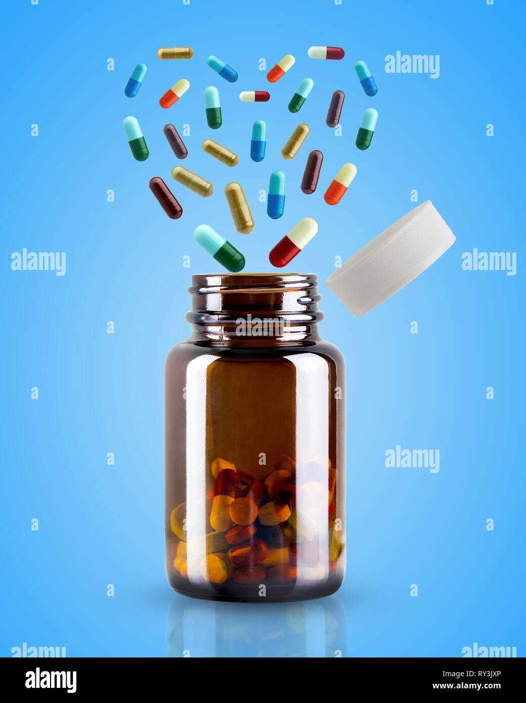 The medicine bottle is opened and the pill is floating in the shape of ...