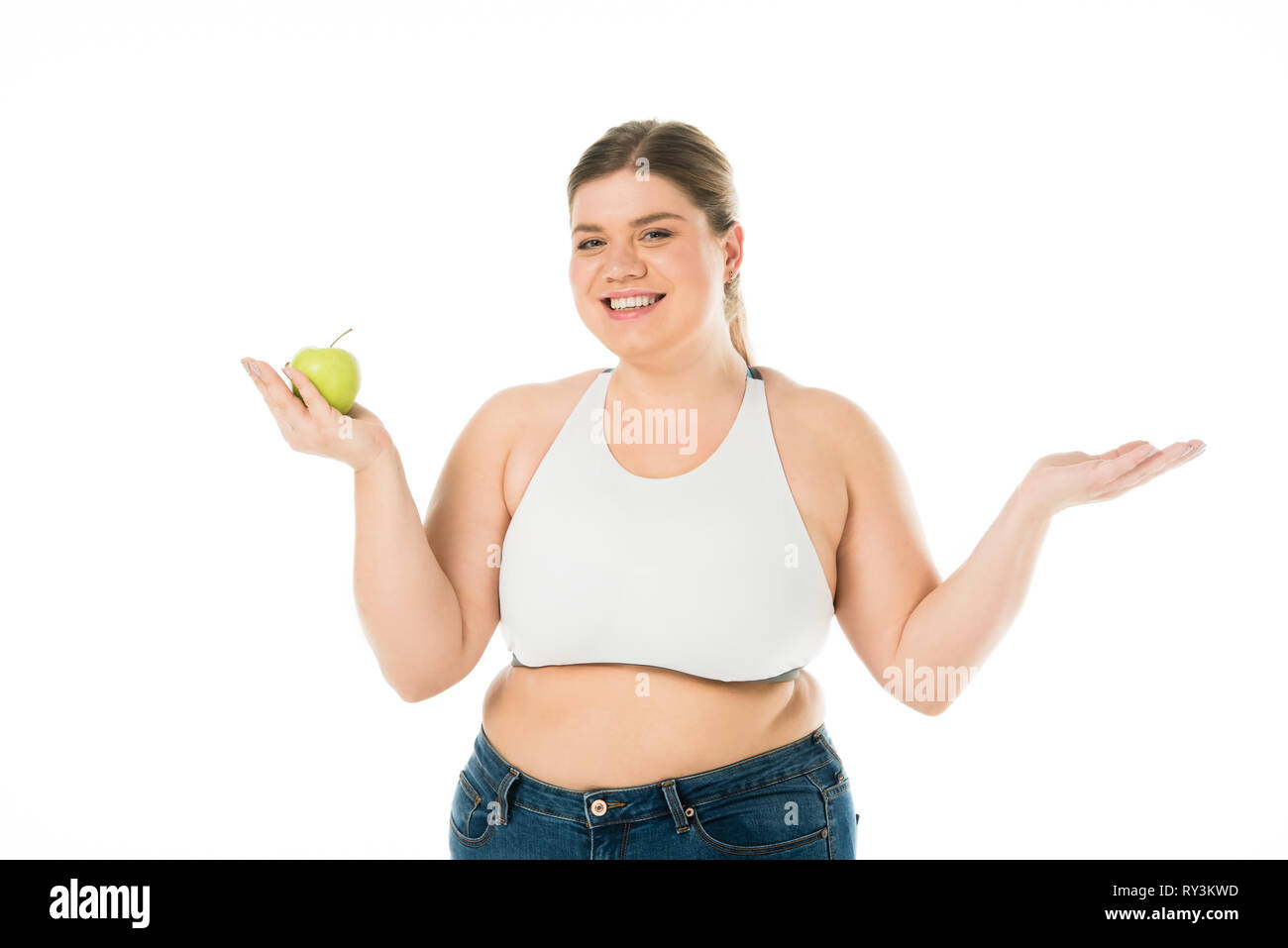happy smiling overweight woman holding green apple isolated on white ...