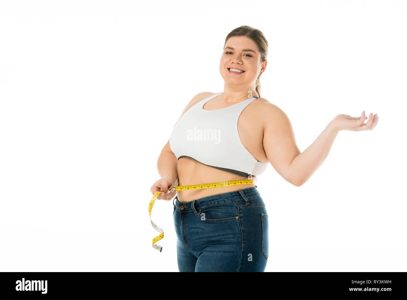 smiling overweight woman measuring waist with measuring tape isolated ...
