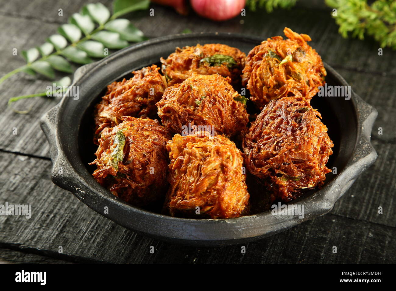 Delicious homemade ullivada,pakoda, onion fritters from Indian cuisine ...