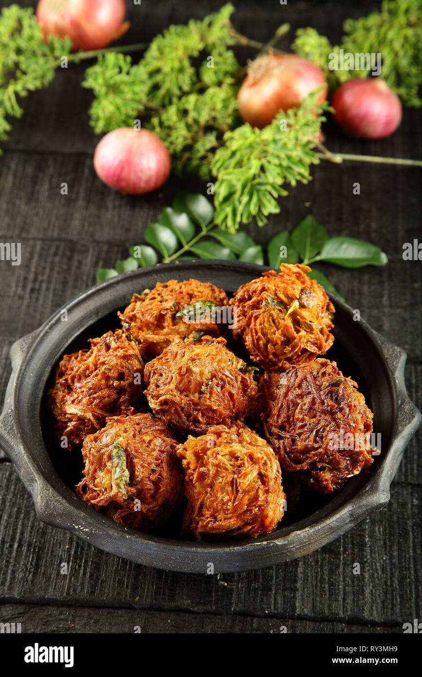 Spicy crispy fried onion fritters , ulli vada, pakora,pakoda, Indian ...