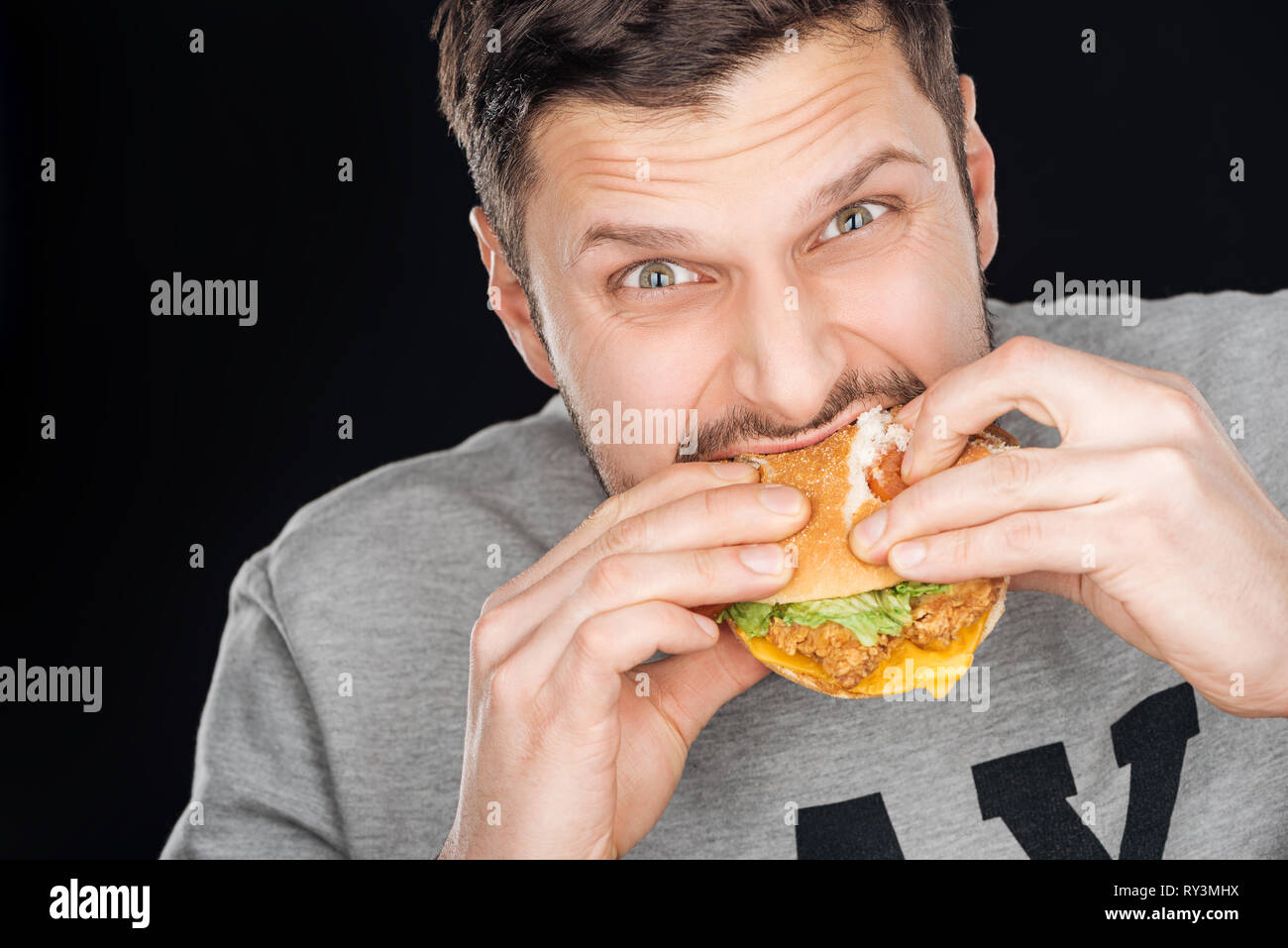 Man eating chicken burger hi-res stock photography and images - Alamy