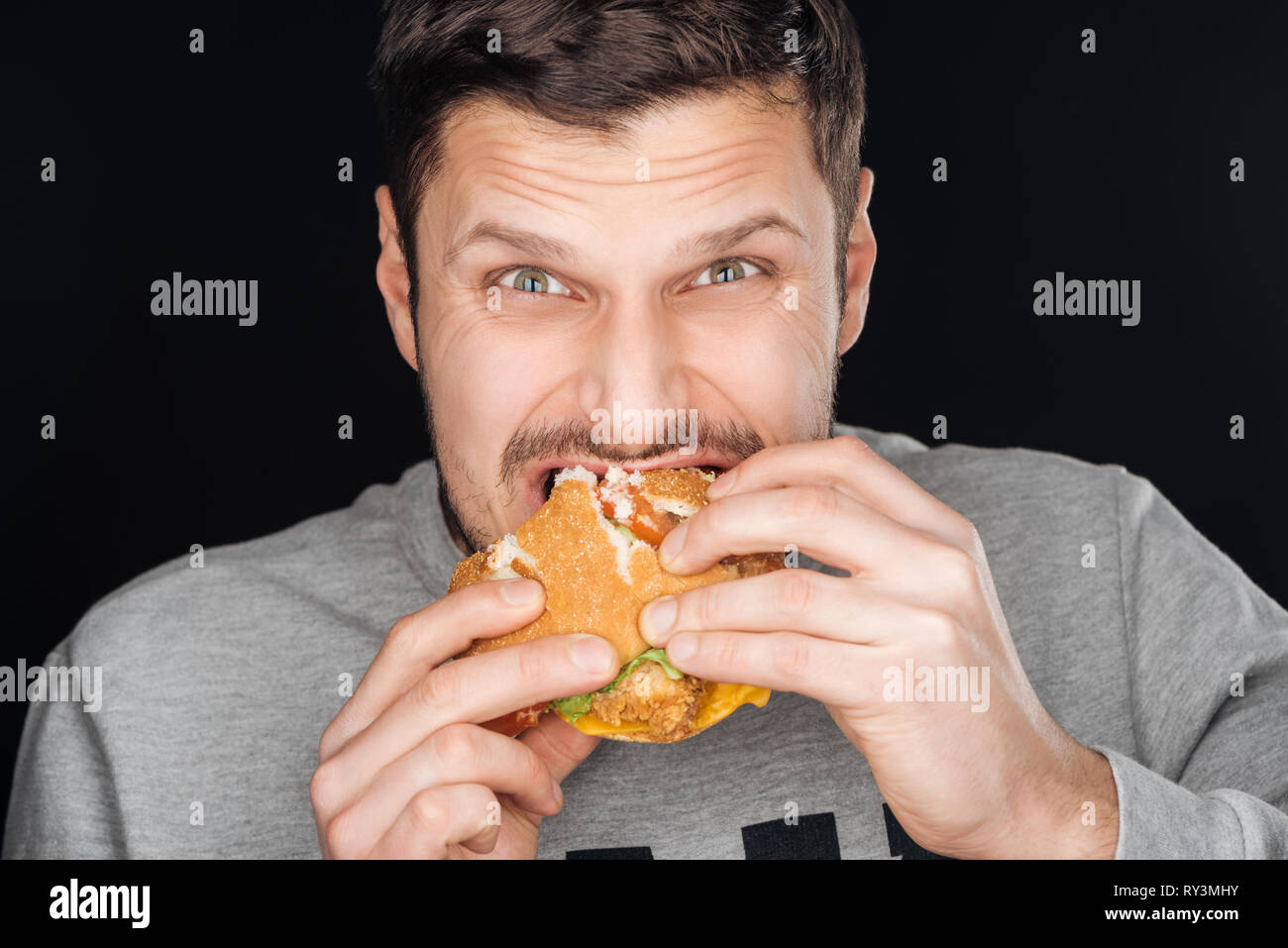 Man eating chicken burger hi-res stock photography and images - Alamy