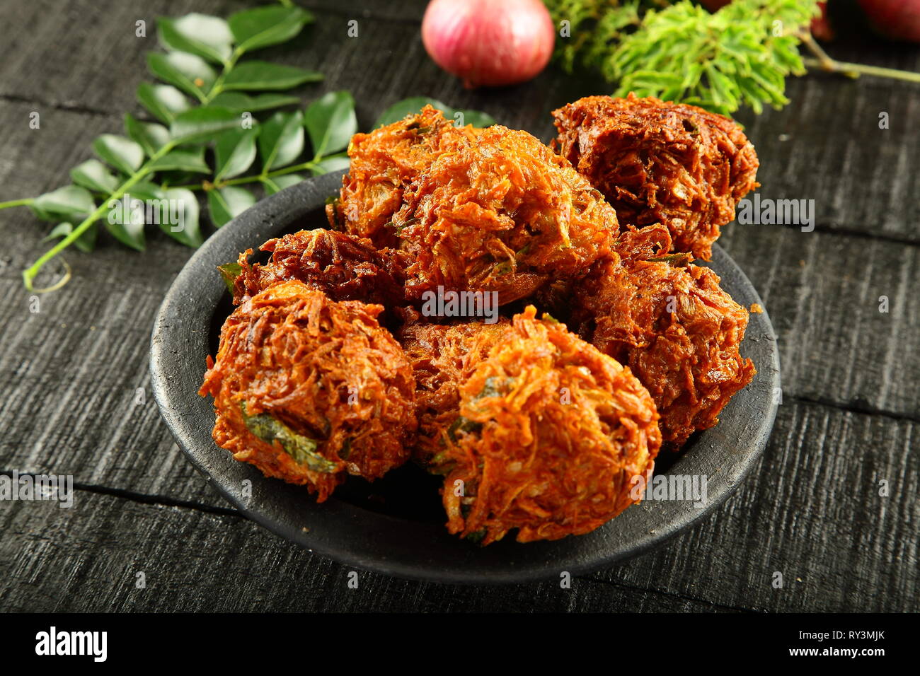 Spicy crispy fried onion fritters , ulli vada, pakora,pakoda, Indian ...