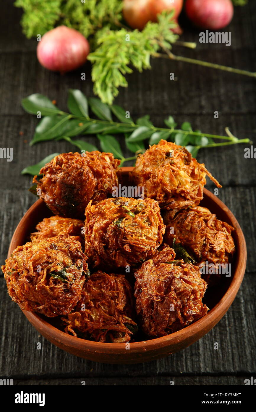 Spicy crispy fried onion fritters , ulli vada, pakora,pakoda, Indian ...