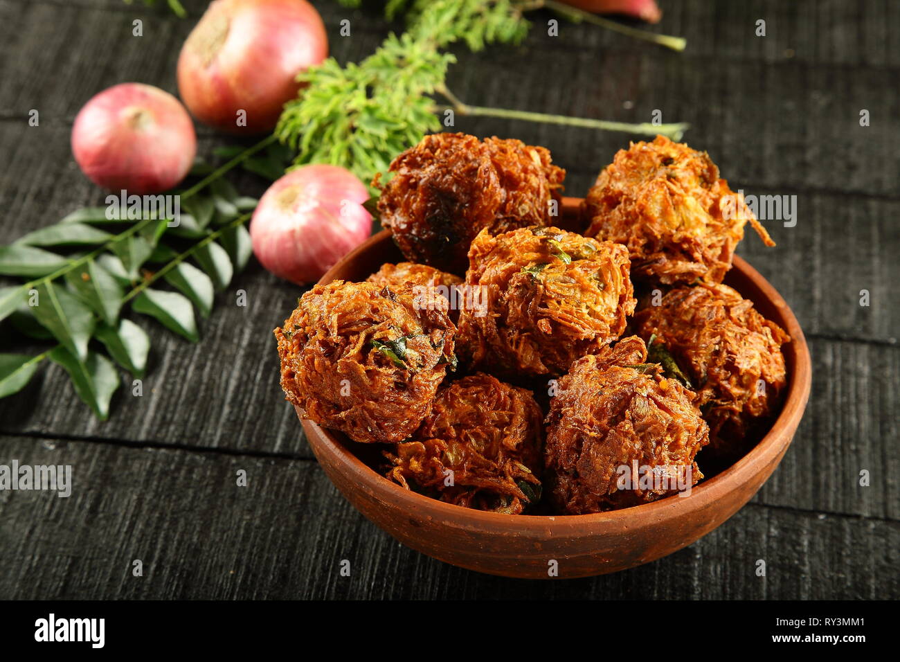 Spicy crispy fried onion fritters , ulli vada, pakora,pakoda, Indian ...