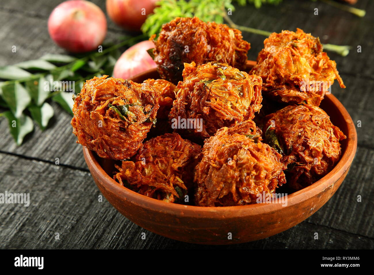 Spicy crispy fried onion fritters , ulli vada, pakora,pakoda, Indian ...