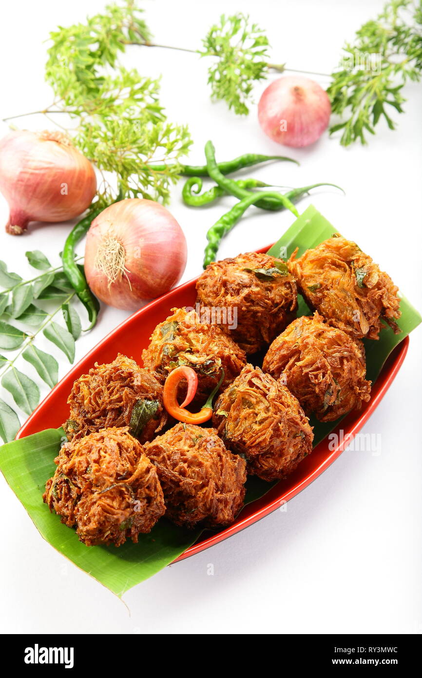 Indian cuisines- crispy fried onin fritters , ulli vada, pakkoda ...