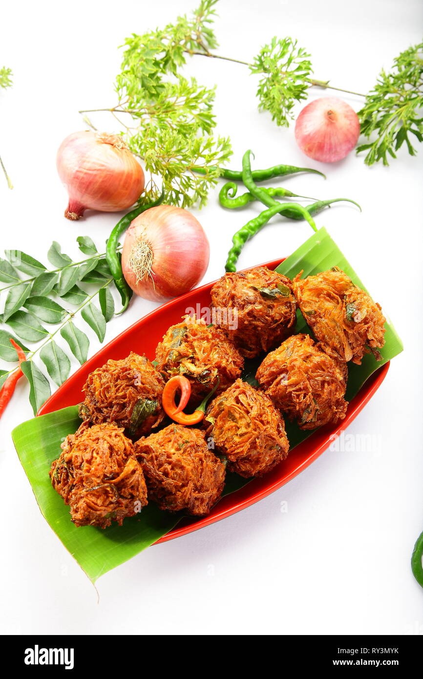 Indian cuisines- crispy fried onin fritters , ulli vada, pakkoda ...